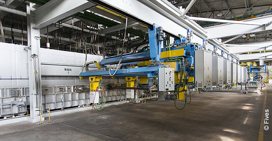 Top rollers in a tin bath operate to control glass ribbon width and ...